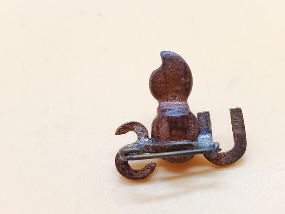 Antique US Military Flaming Bomb metal and leather pin - Gem
