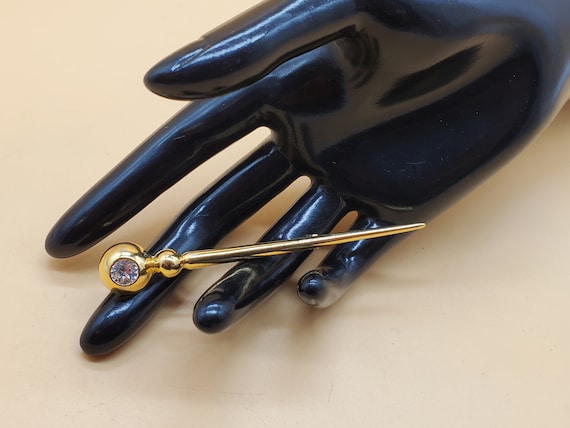 vintage gold tone long staff scepter brooch with clea… - Gem