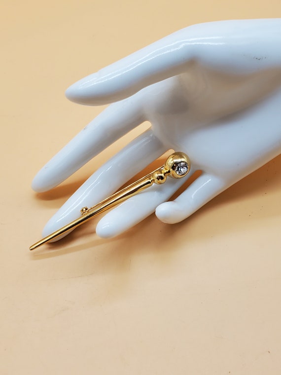 vintage gold tone long staff scepter brooch with clea… - Gem