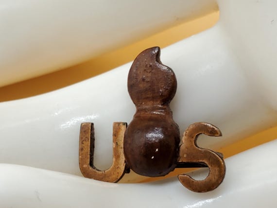 Antique US Military Flaming Bomb metal and leather pin - Gem