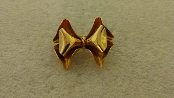 Small Grosse 1958 gold-tone bow pin - Gem