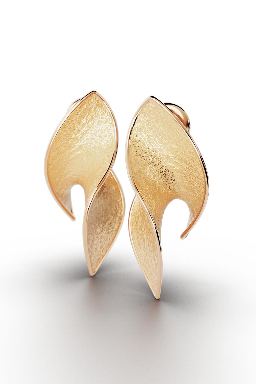 Modern Gold Earrings With Sleek, Sculptural Design, Showcasing ...