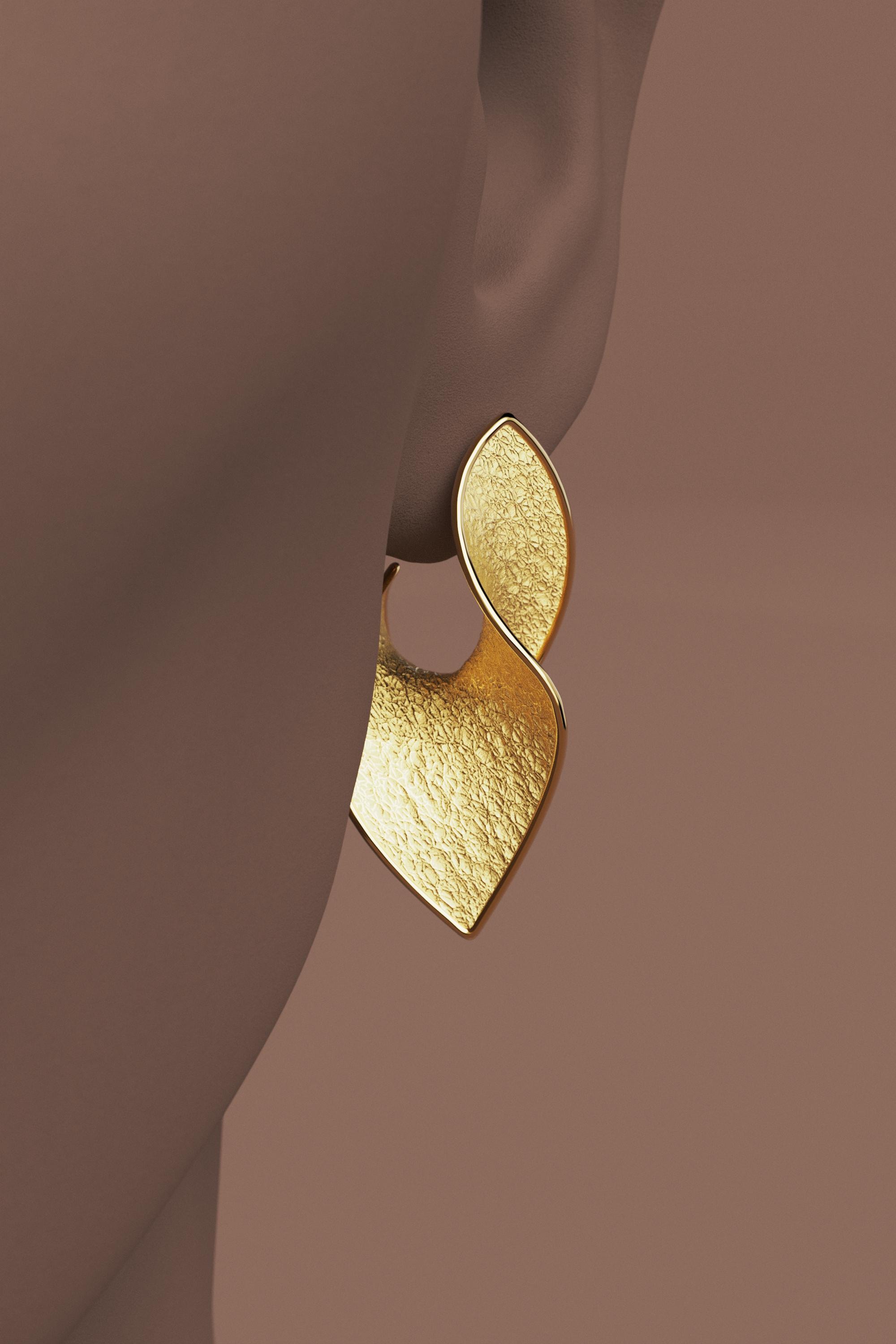 Modern Gold Earrings With Sleek, Sculptural Design, Showcasing ...