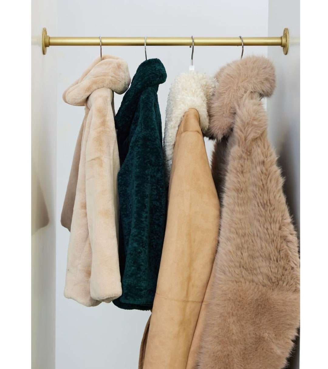 Clothes Rail Between Two Walls in the Trend Color Gold Industrial Coat ...