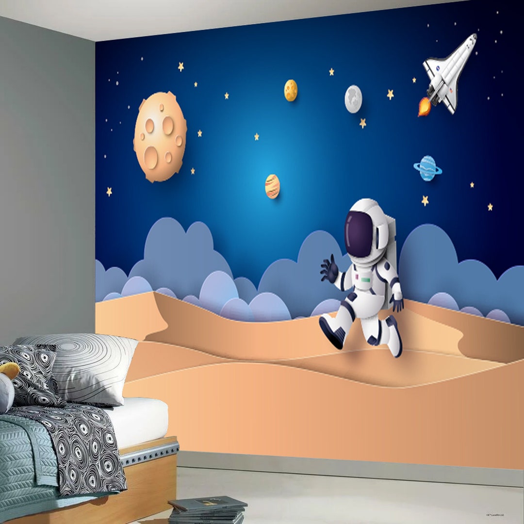Space Wall Mural - Cartoon Astronaut Jumping on Planet Full Wall Mural ...