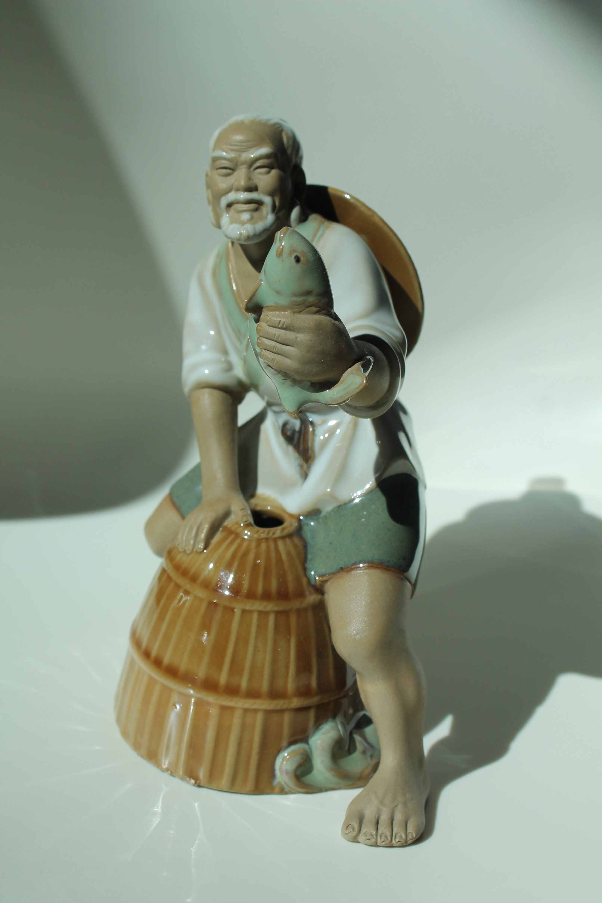 Fisherman Holding a Fish Mudman Figure china - Etsy