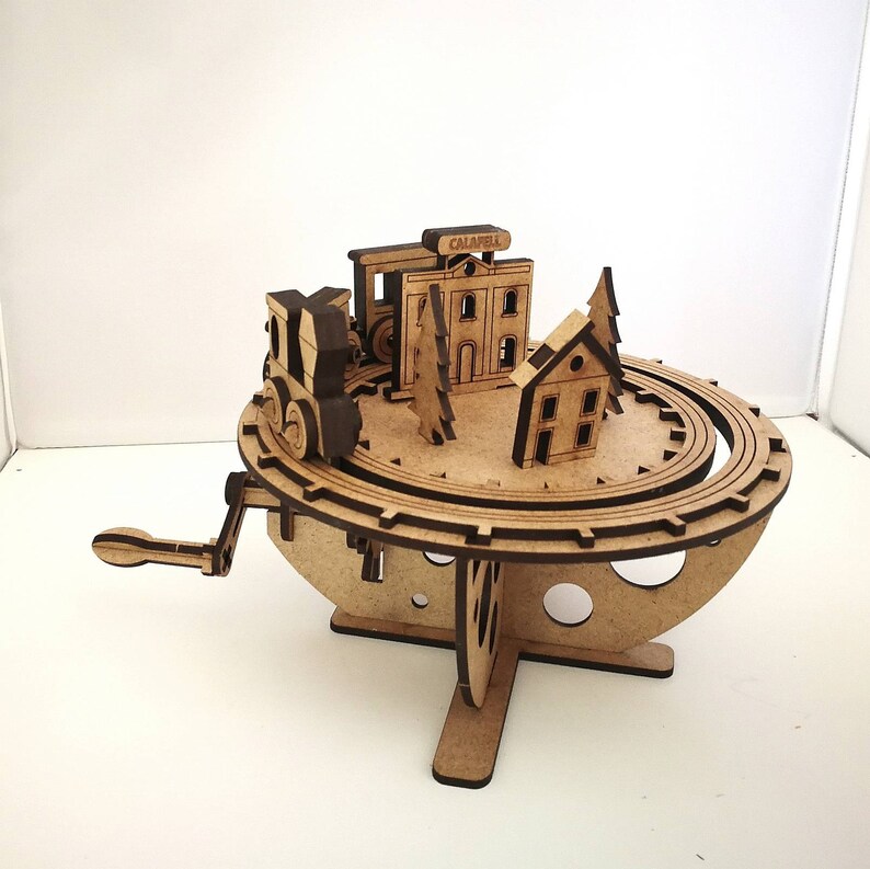 Puzzle / automata with movement of train traveling through the | Etsy