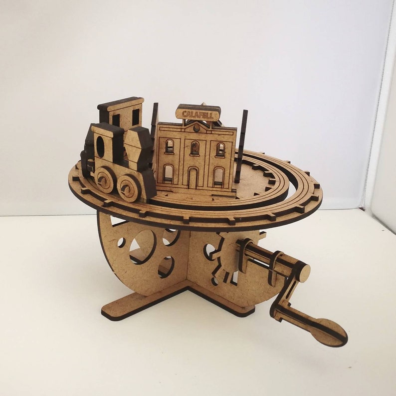 Puzzle / automata with movement of train traveling through the | Etsy