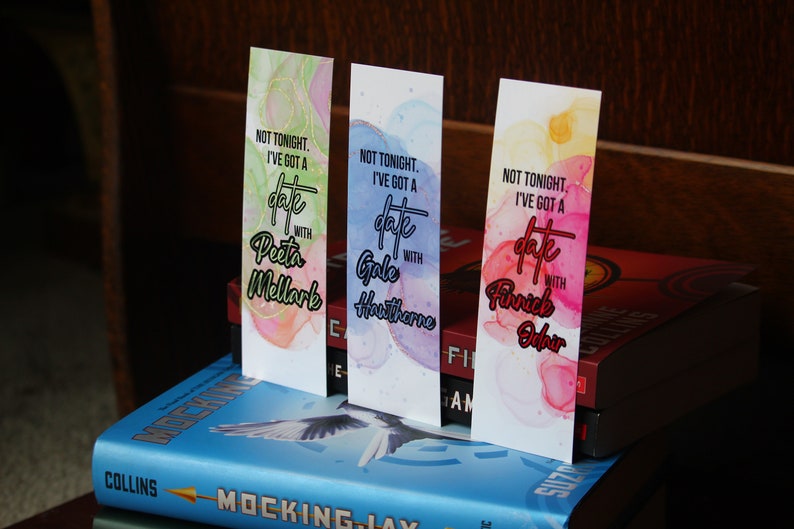 Hunger Games Book Merch Featuring dates With Hunger Games & Prequel ...