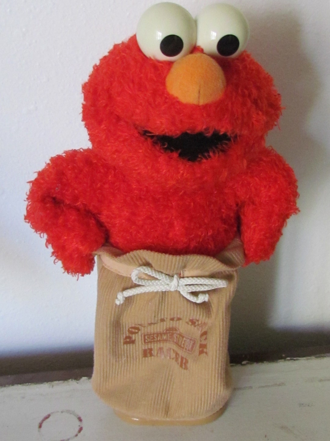 Sesame Street Potato Sack Racer Elmo Bounces and Talking Jumping Plush ...