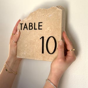 Beige Travertine Wedding Table Numbers: Chiseled Custom Stone, Black ...