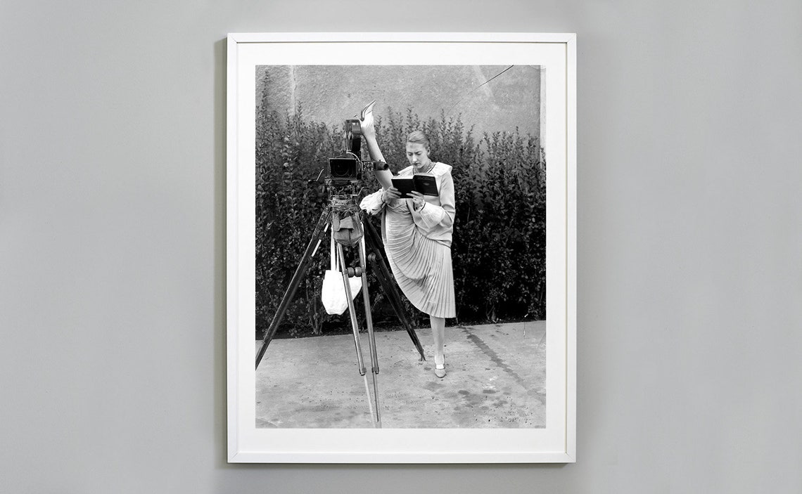 Dancer Reading Print, Actress Kicking Leg up on Camera Reading a Book ...