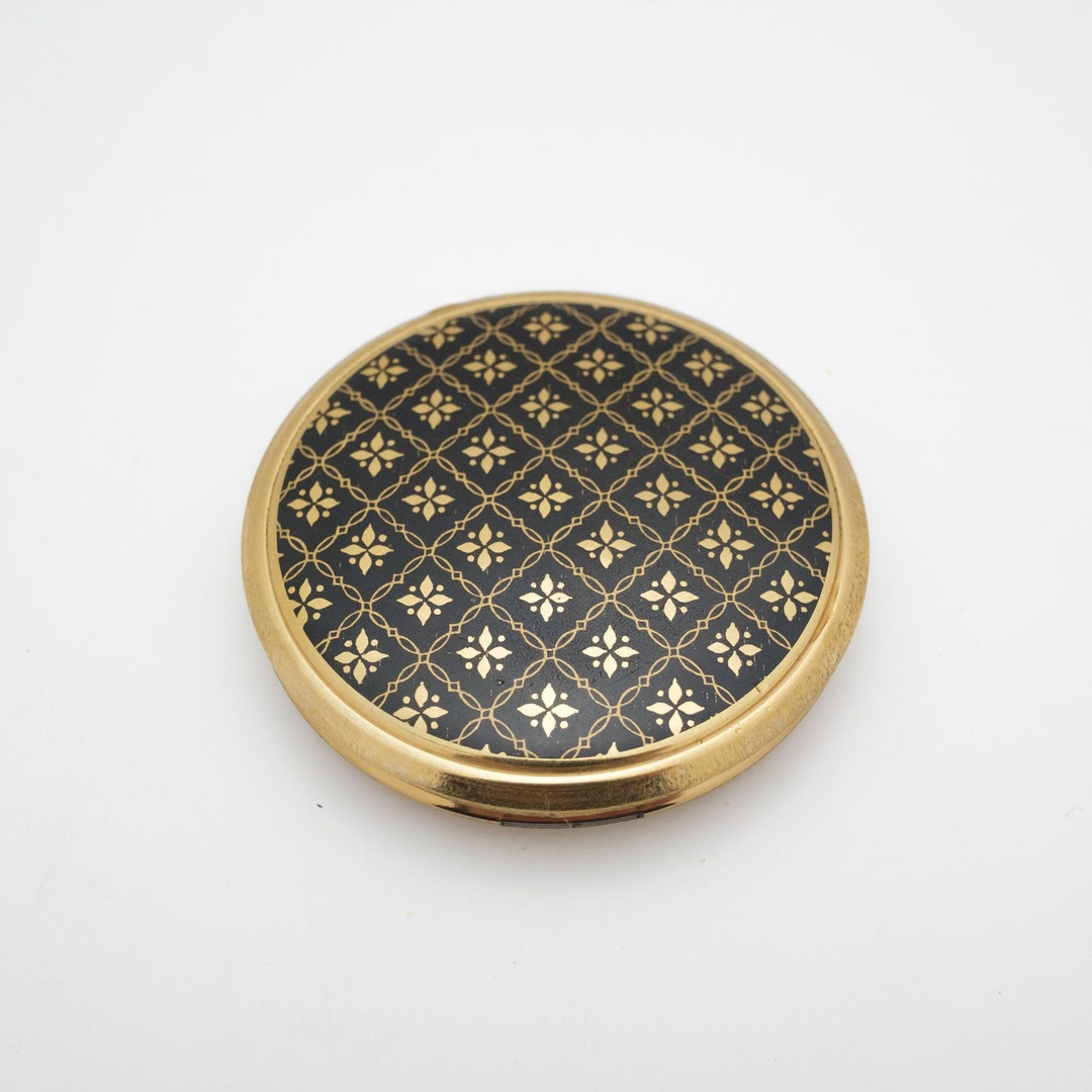 Brass Compact With a Black Pattern Decor on a Brass Background Made In ...