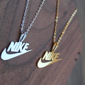 Nike logo necklace store