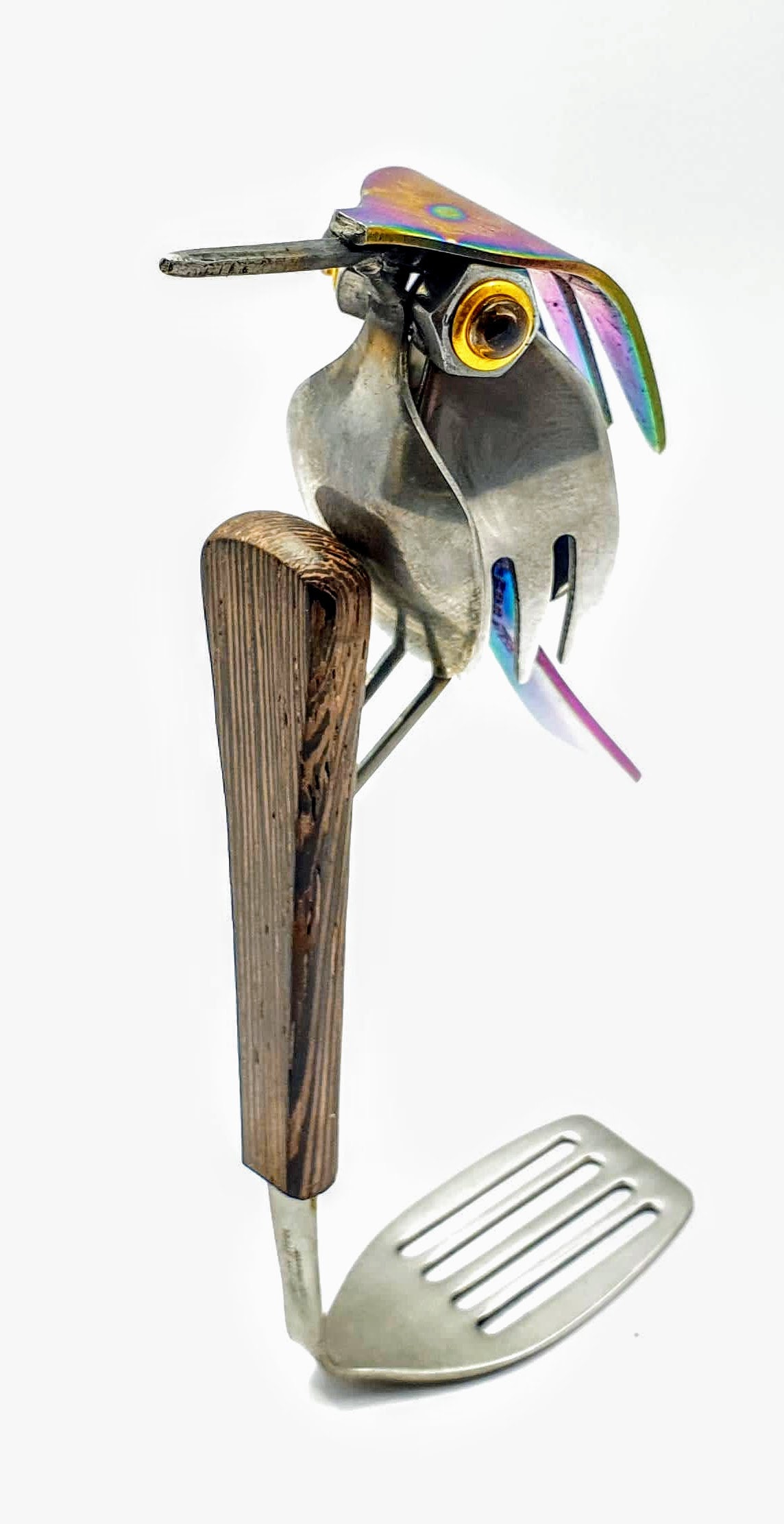 Lovely cutlery finch bird perched on a vintage hand tool and gears base ...