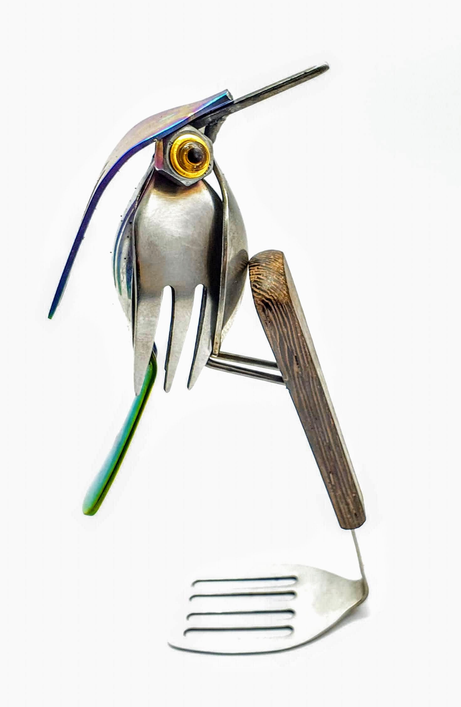 Lovely cutlery finch bird perched on a vintage hand tool and gears base ...