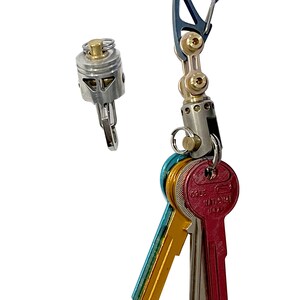 KYLINK Rotating Skull Piston Bob Keychain With Clip & Ring Basic Swivel ...