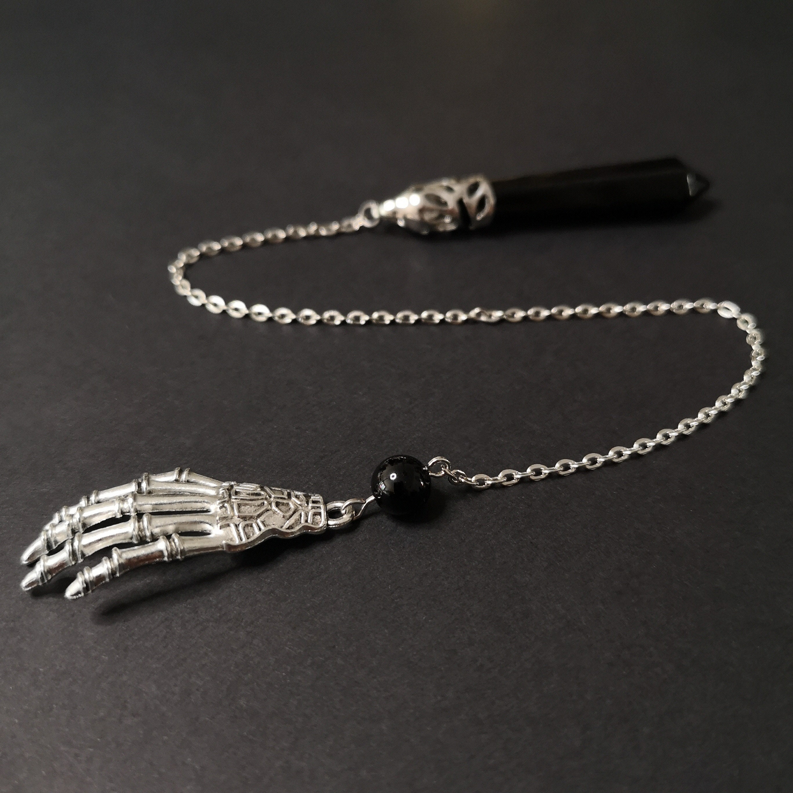 Divination tool Onyx and obsidian skeleton hand goth pendulum | Etsy