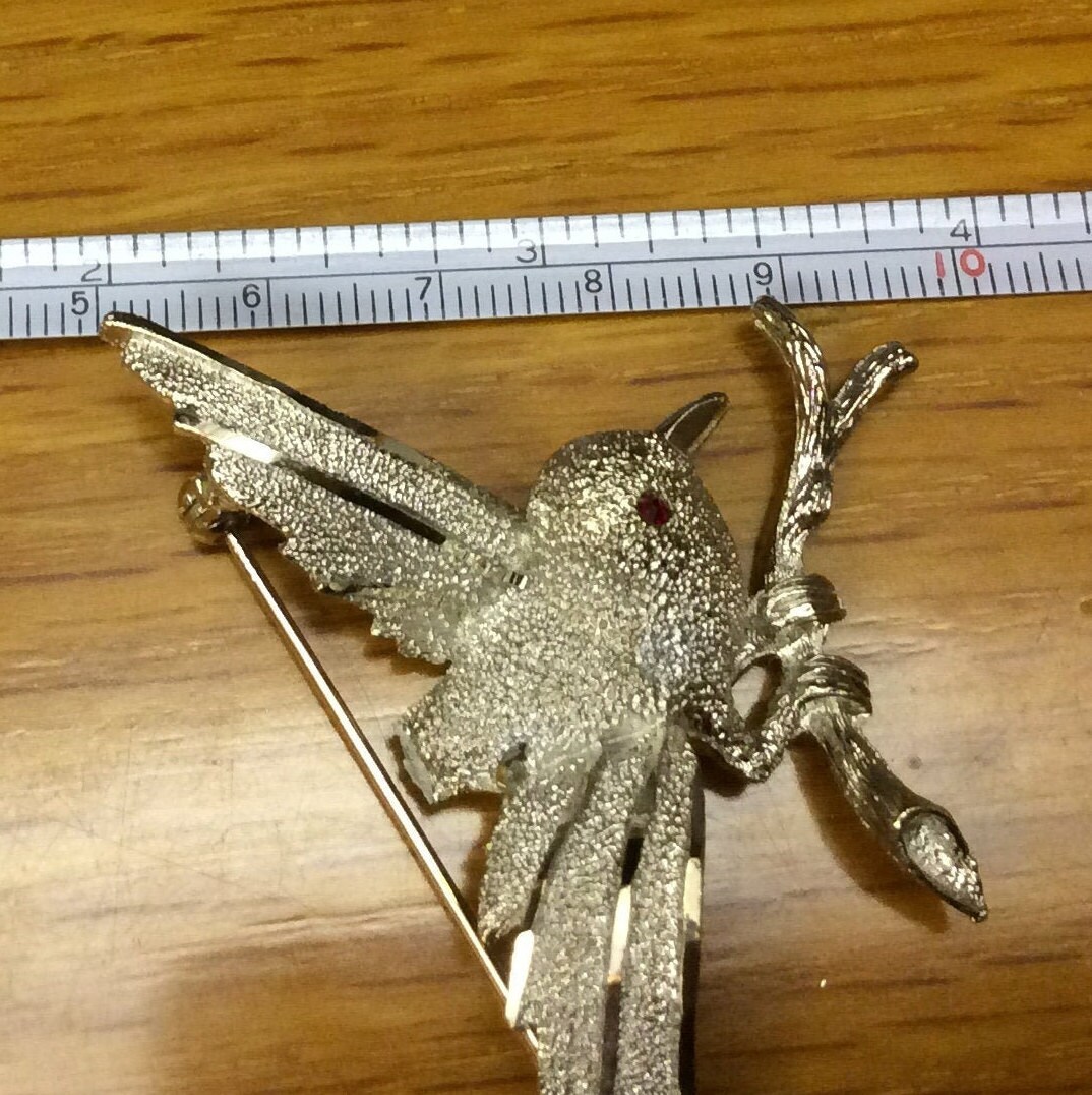 BSK silver tone flying bird brooch with red crystal eye | Etsy
