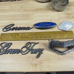 Assorted Car Emblems, Ford, Corona, Grand Fury, Mercury, Honda, Sachs ...