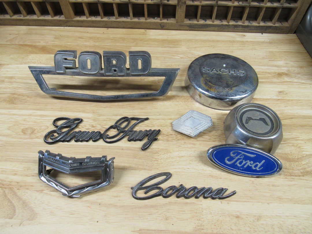 Assorted Car Emblems, Ford, Corona, Grand Fury, Mercury, Honda, Sachs ...