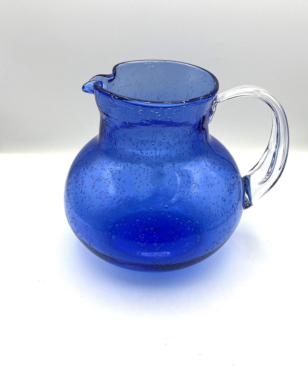 Vintage Large Blue Hand Blown Glass Pitcher With Clear Handle. 3 -1/2 ...
