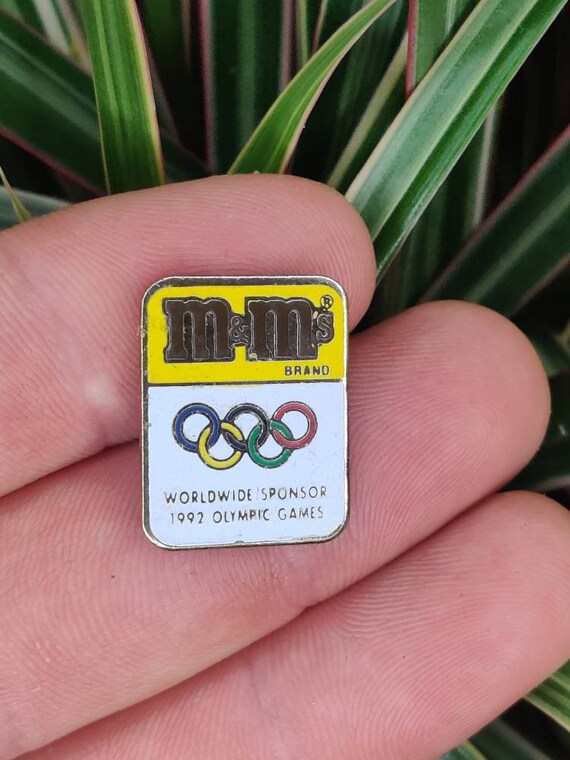 M and M's 1992 Olympic games sponsor pin badge Hat ti… - Gem