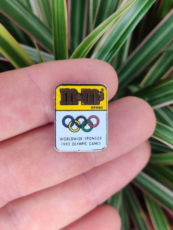 M and M's 1992 Olympic games sponsor pin badge Hat ti… - Gem