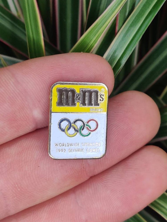 M and M's 1992 Olympic games sponsor pin badge Hat ti… - Gem