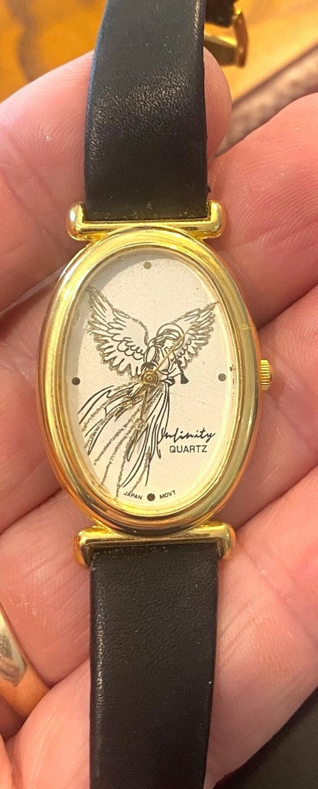 VTG Women's 25mm Gold Tone Infinity Watch, Trumpet Blowing Angel on ...