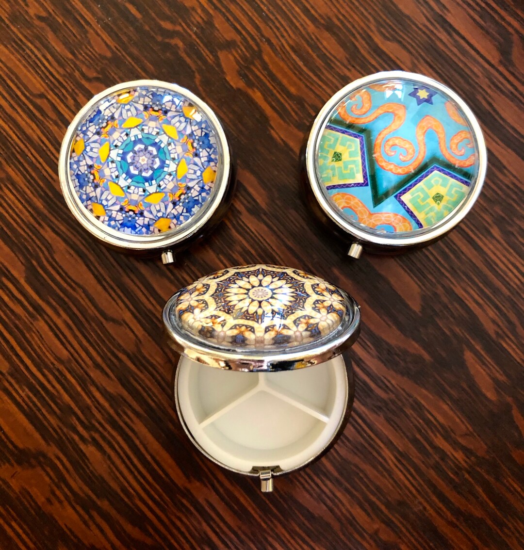 Pill Boxes With Vivid, Original Designs Set on Stainless Steel Base ...