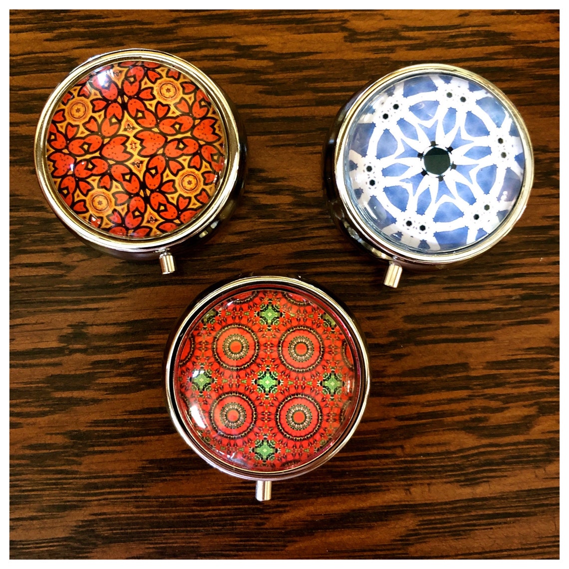 Pill Boxes With Vivid, Original Designs Set on Stainless Steel Base ...