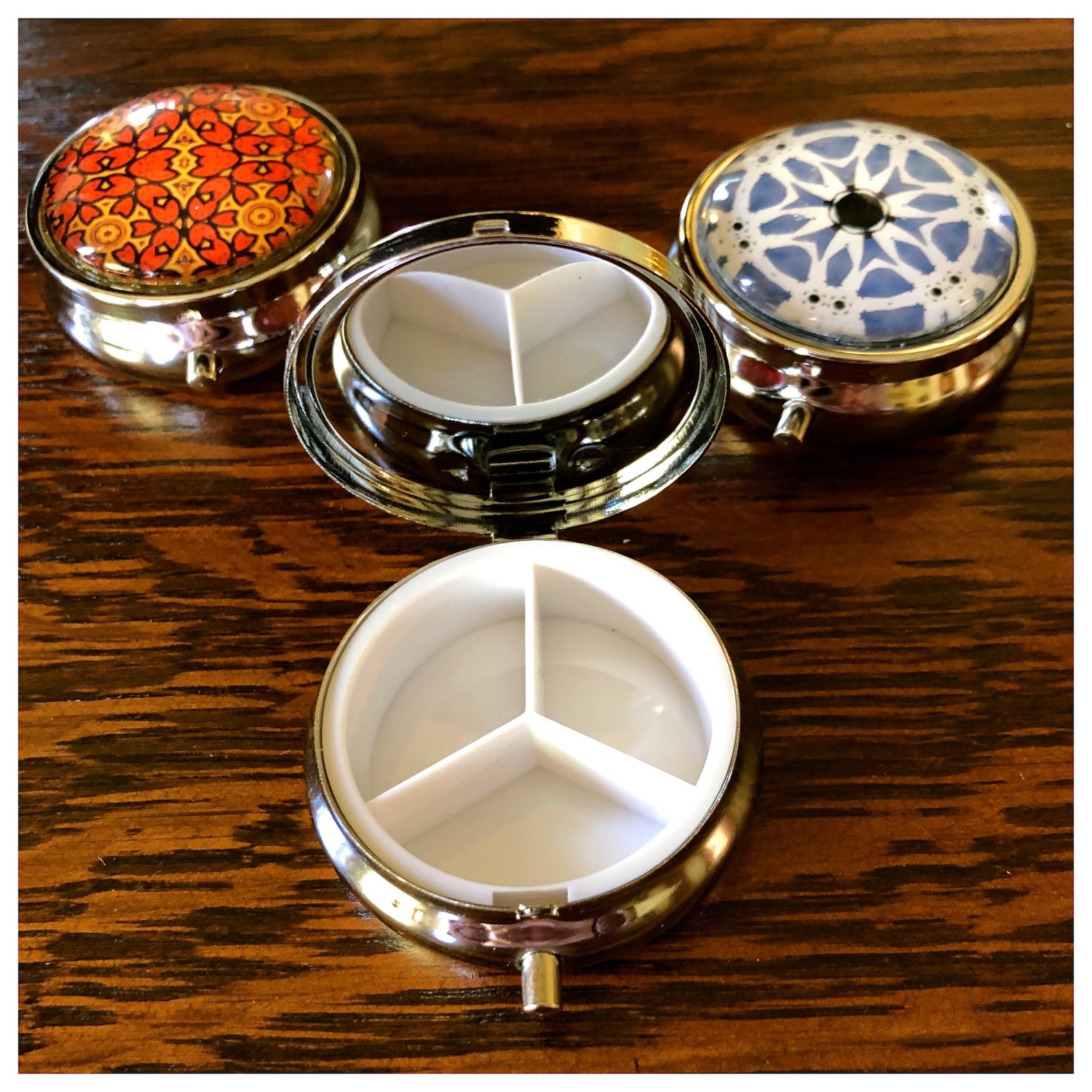 Pill Boxes With Vivid, Original Designs Set on Stainless Steel Base ...