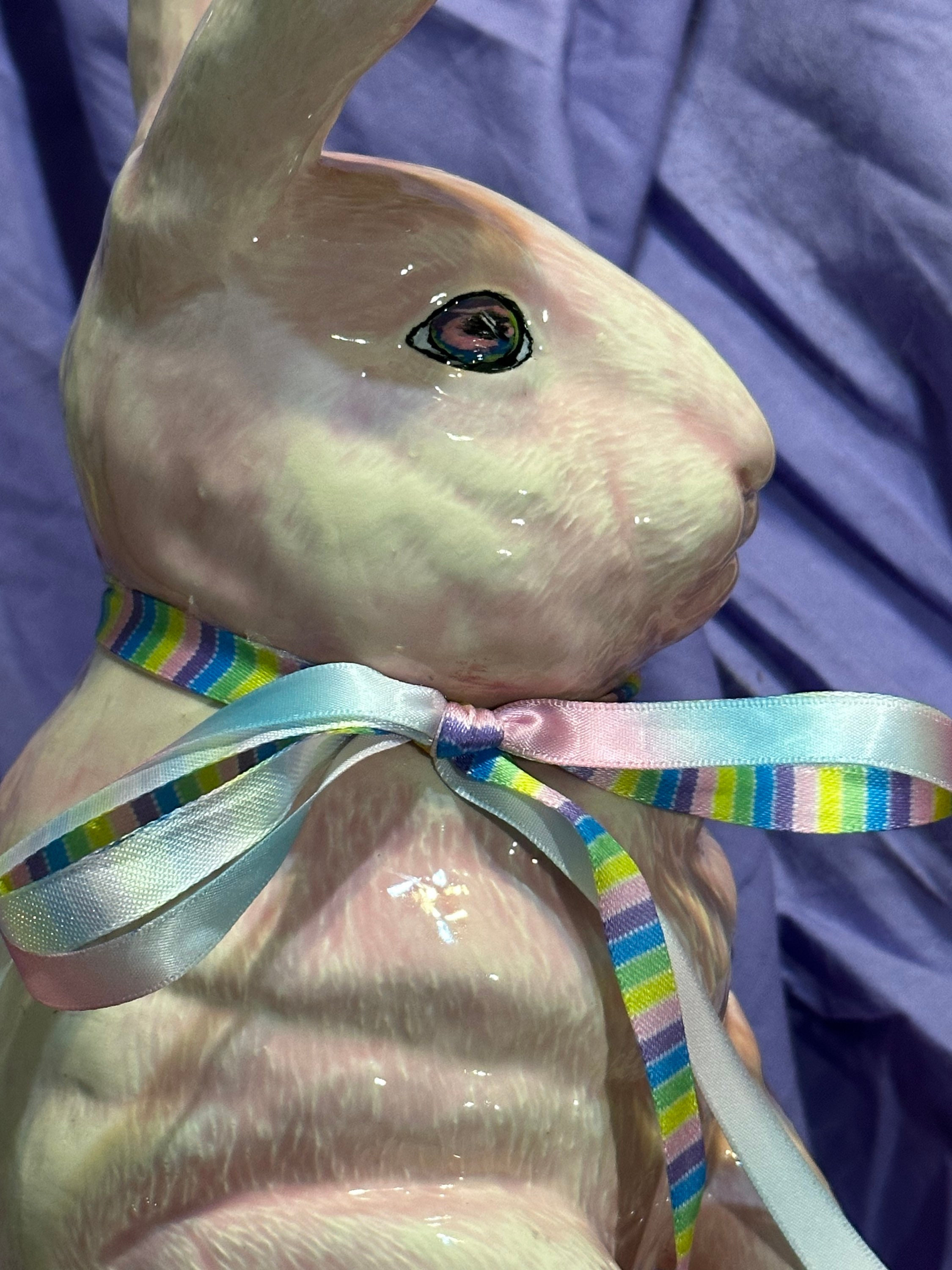 Glazed pink ceramic rabbit with ribbons by jmdceramicsart