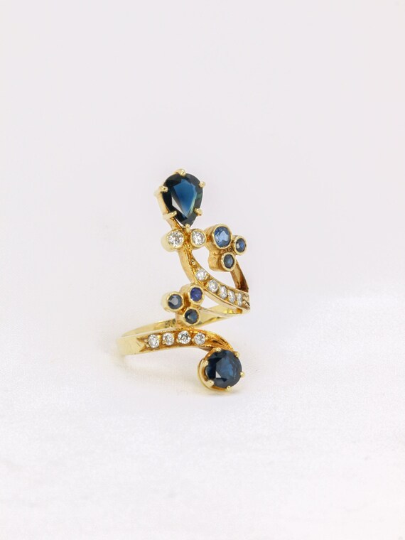 Arabesque ring in gold, diamonds and sapphires - Gem