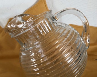 Tilt ball pitcher | Etsy