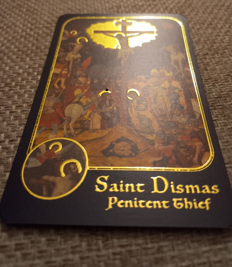 St. Dismas Holy Card With Gold Foil Border. It is 2.75