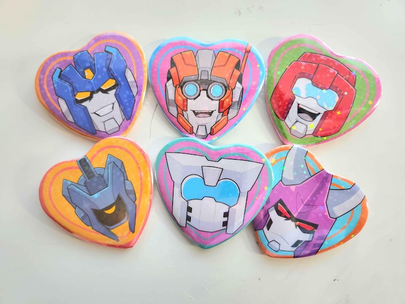 Transformers IDW Holo Heart Buttons - Etsy
