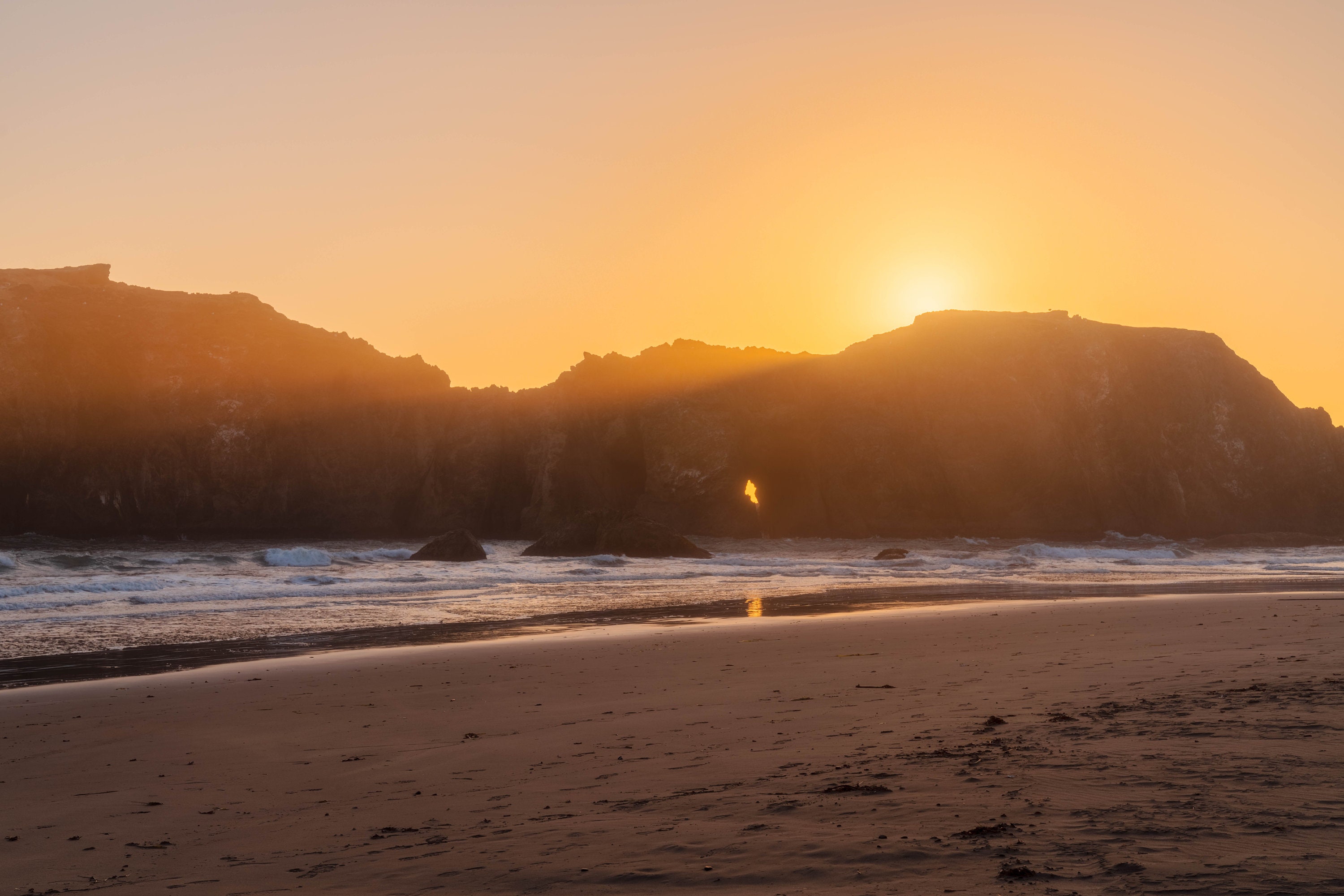 Sunset Beams Glowing Behind Rock Formation in Ocean, Fine Art Seascape ...