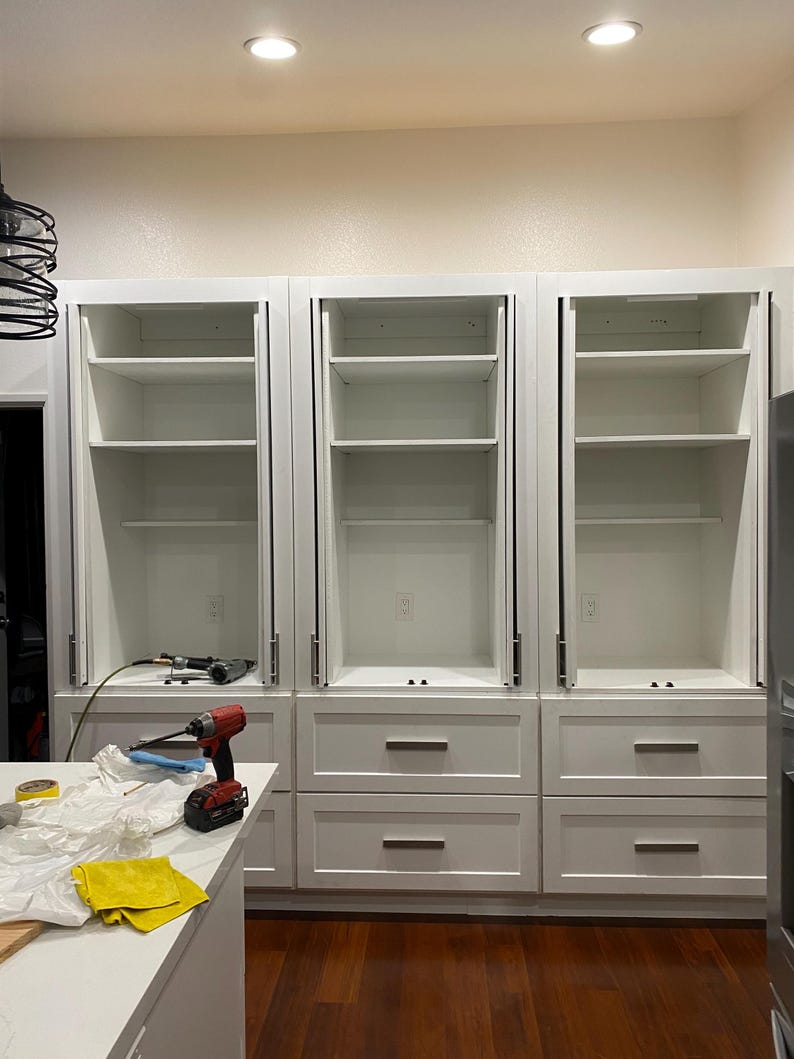Three Unit Kitchen Cabinet With Shelves and Pocket Sliding Doors and ...