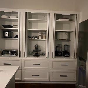 Three Unit Kitchen Cabinet With Shelves and Pocket Sliding Doors and ...