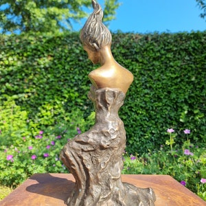 Abstract Bronze Sculpture of a Kneeling Woman Graceful and Simple at ...
