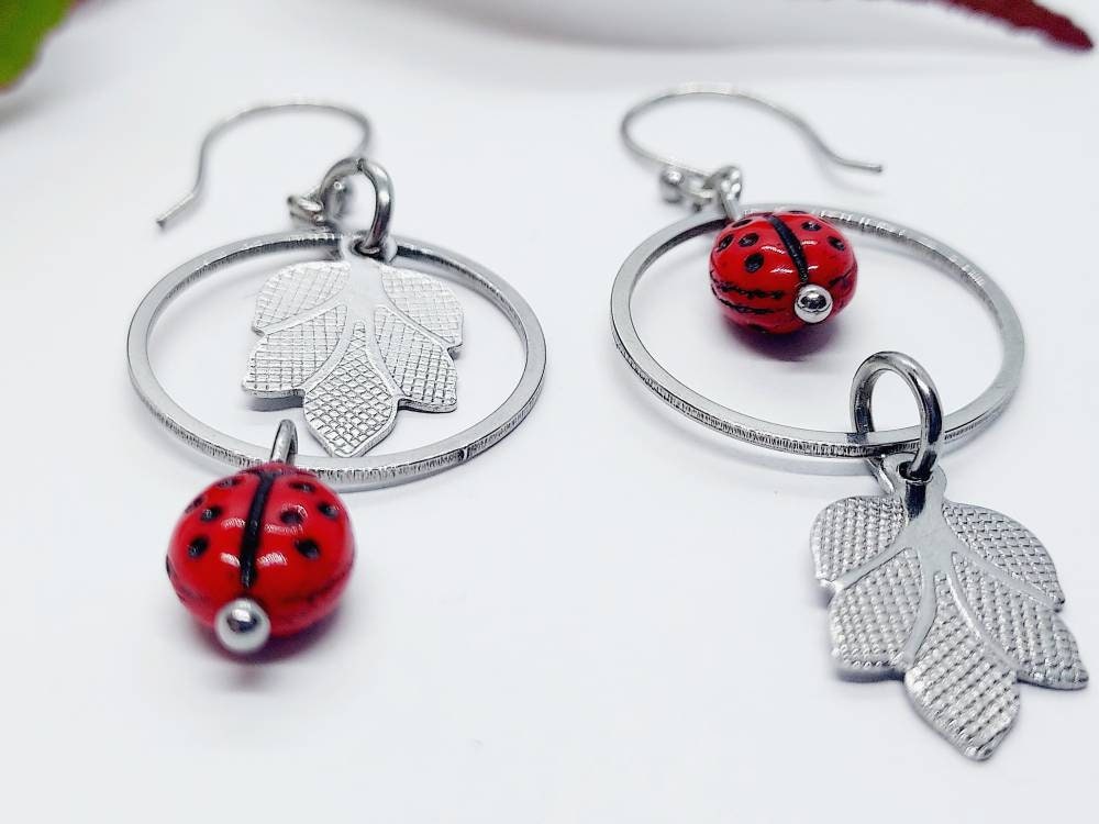 Ladybird Asymmetrical Earrings With Open Circles and Leaf Charms ...