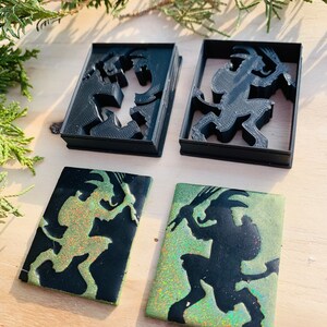 Inverted Mirrored Pair of Krampus Silhouettes Embossed Sharp Clay ...