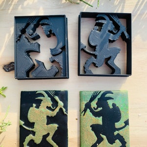 Inverted Mirrored Pair of Krampus Silhouettes Embossed Sharp Clay ...