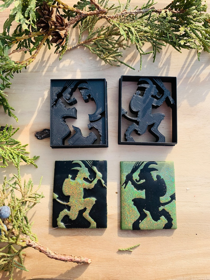 Inverted Mirrored Pair of Krampus Silhouettes Embossed Sharp Clay ...