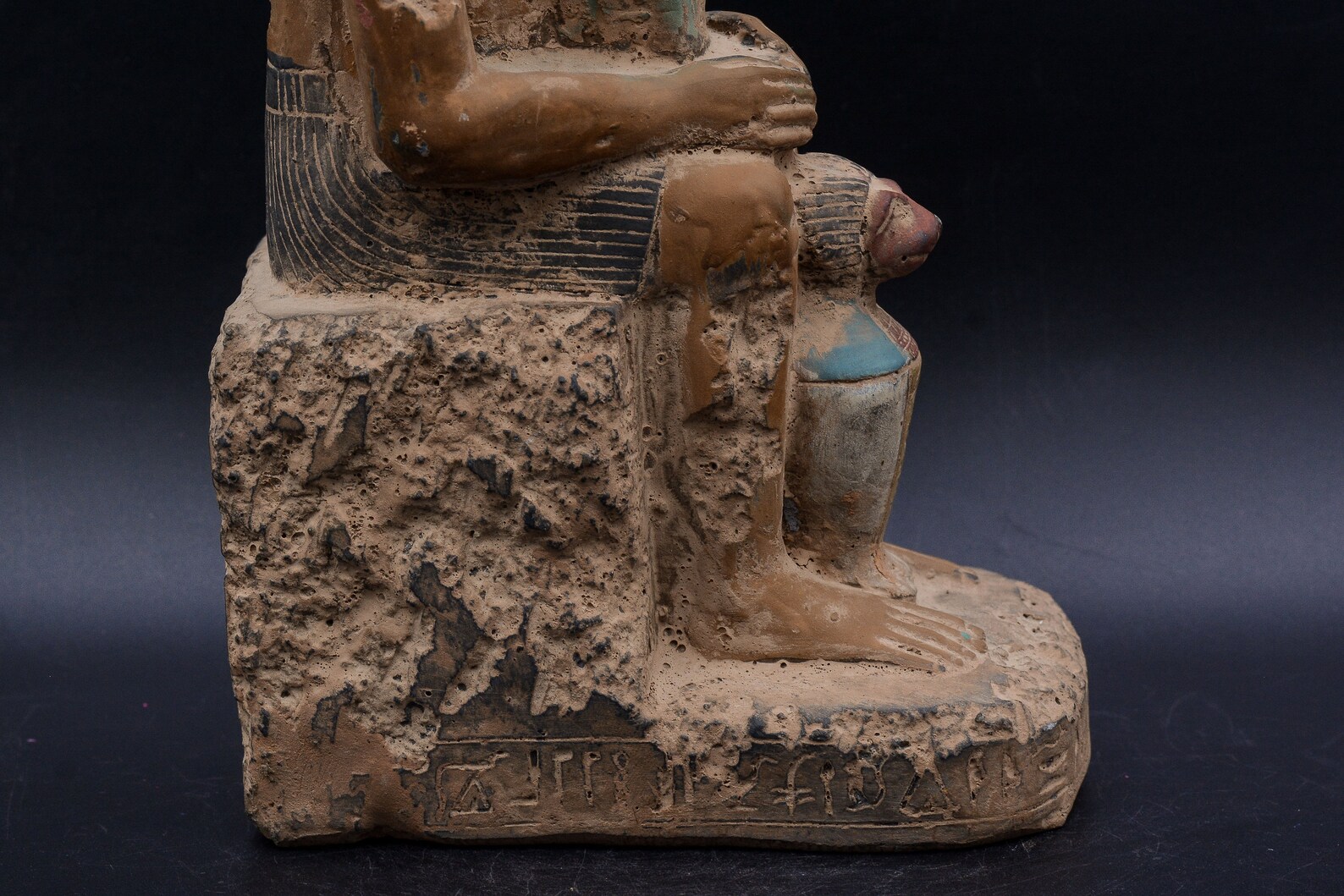 Seated Anubis Holding a Mummy Form With a Hapi (son of Horus) Resting ...