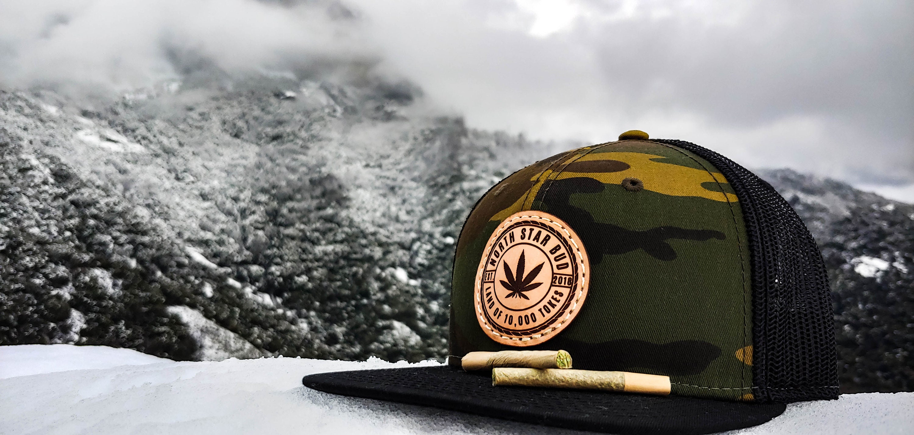 Minnesota Cannabis Leather Patch Woodland Camo Trucker Snapback Hat ...