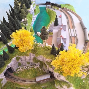 Model Railway With a Realistic Forest Mountain Layout, With Lakes and ...