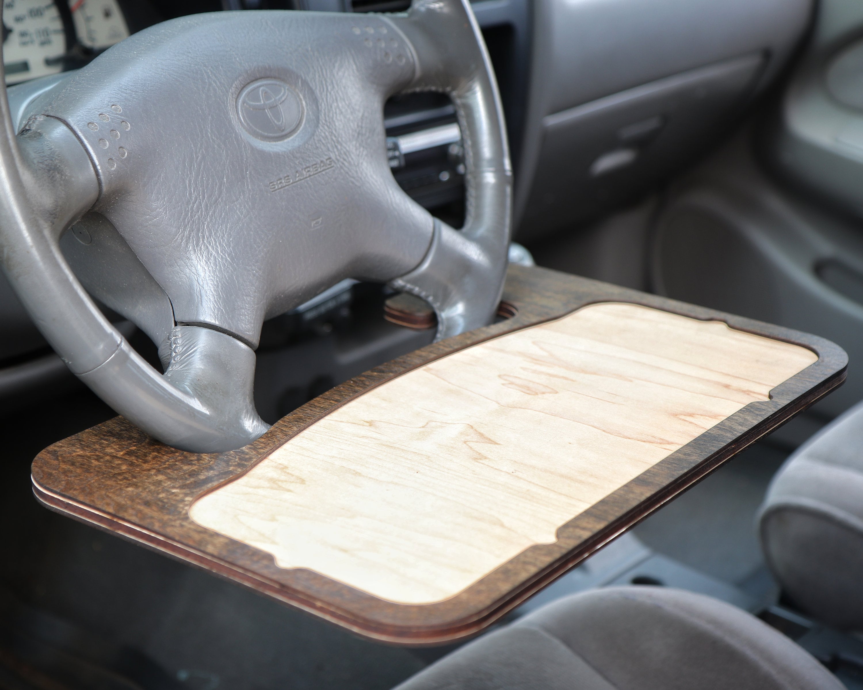 Steering wheel table tray store